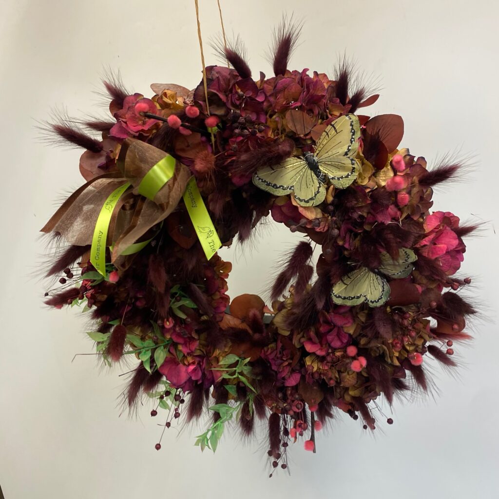 Burgundy And Butterfly Wreath | Brighton Flower Company